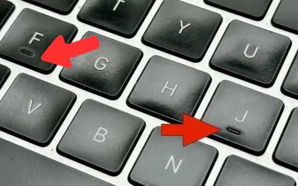 Why do these two characters on the keyboard have raised edges?